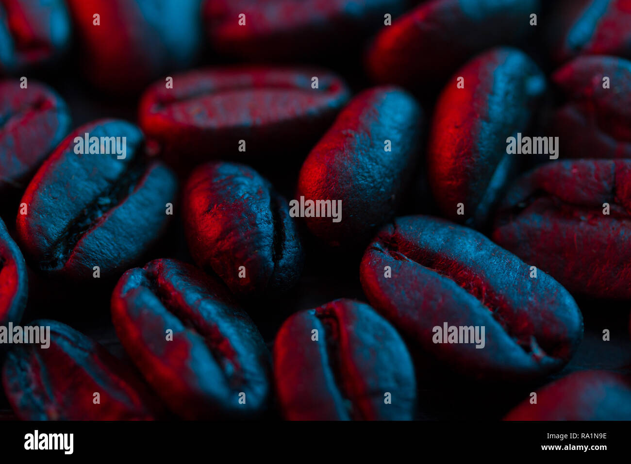 Roasted coffee bean close up in neon light Stock Photo - Alamy