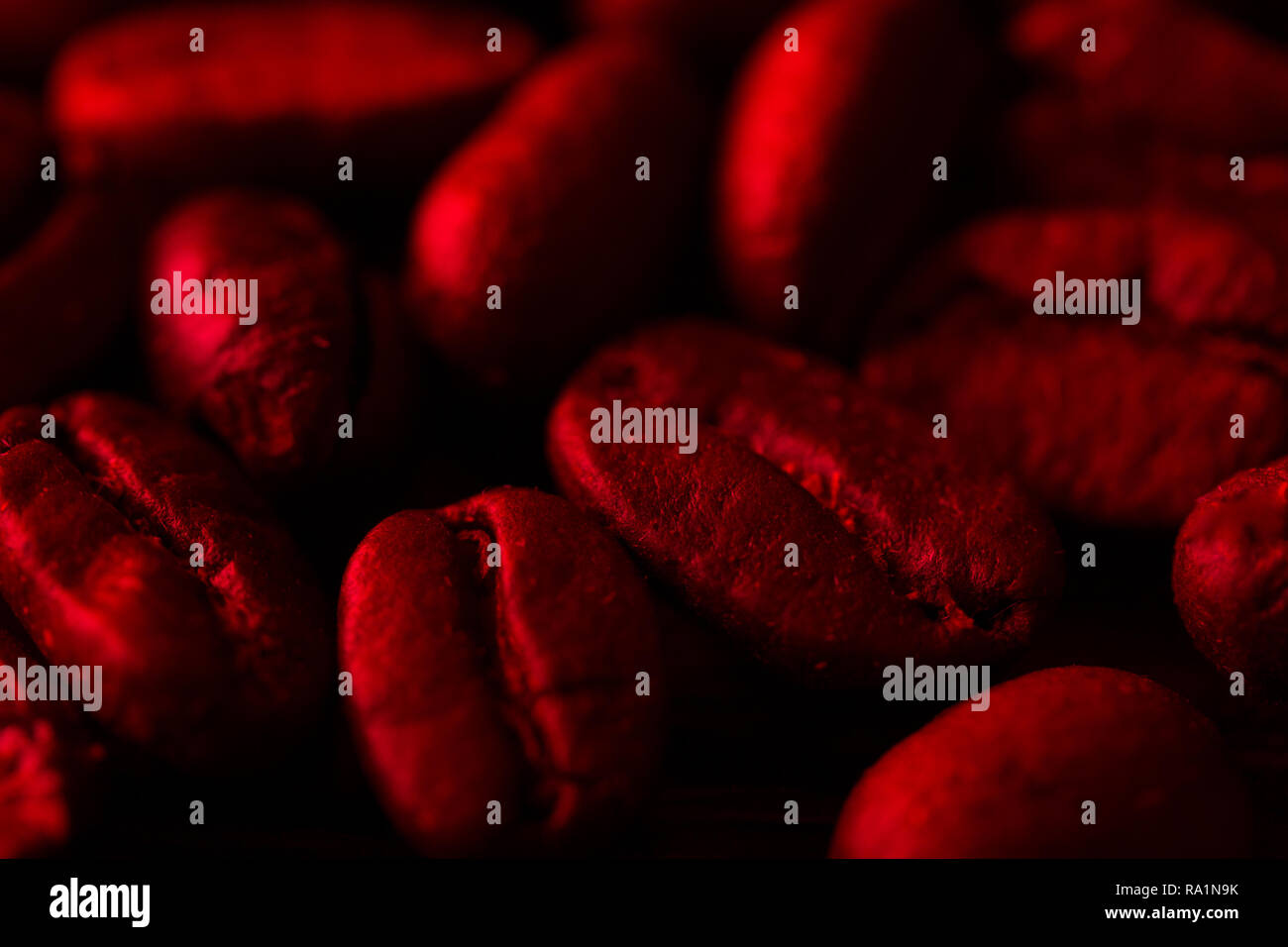 Roasted coffee bean close up in neon light Stock Photo - Alamy