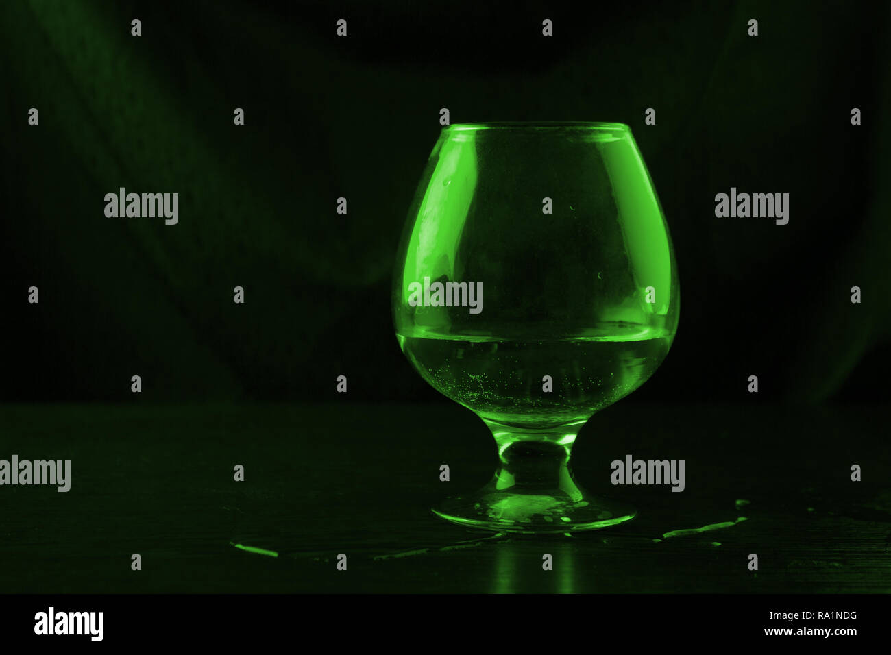 green glass with poisonous liquid in it Stock Photo - Alamy