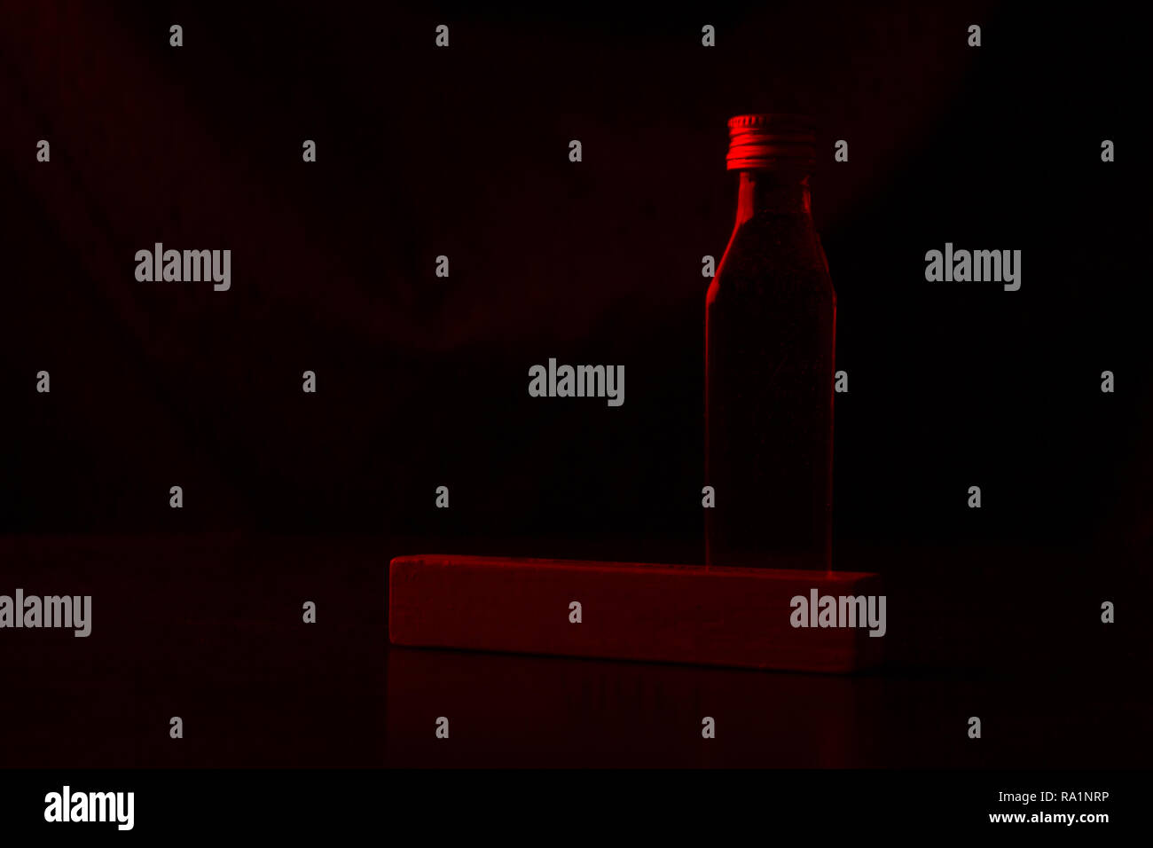 small bottle of alcohol in neon light Stock Photo - Alamy