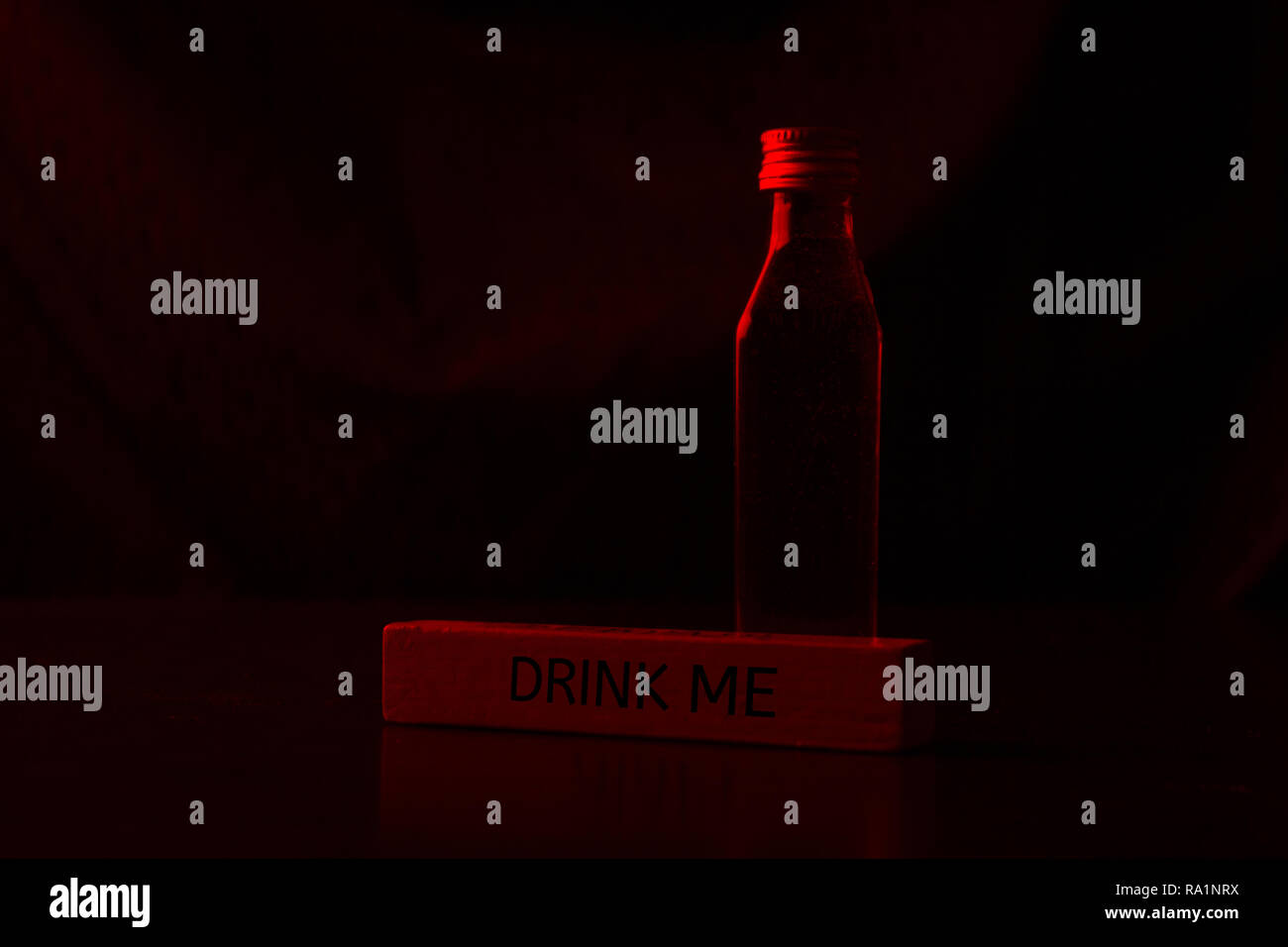 bottle with liquid and sign drink me Stock Photo - Alamy