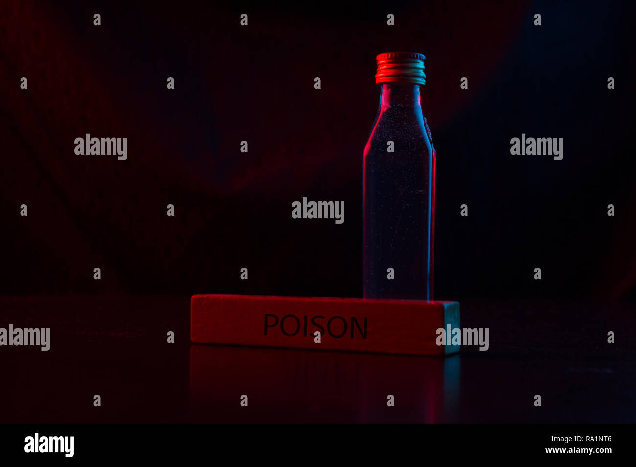 Steaming bottle of poison in neon light. copy space Stock Photo - Alamy