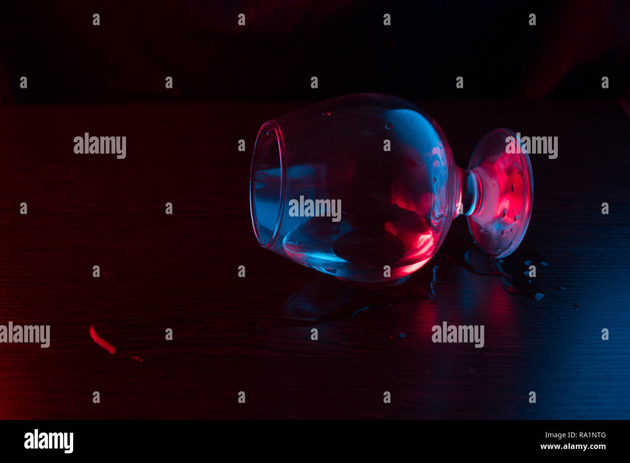 alcohol split from glass. on dark background Stock Photo - Alamy