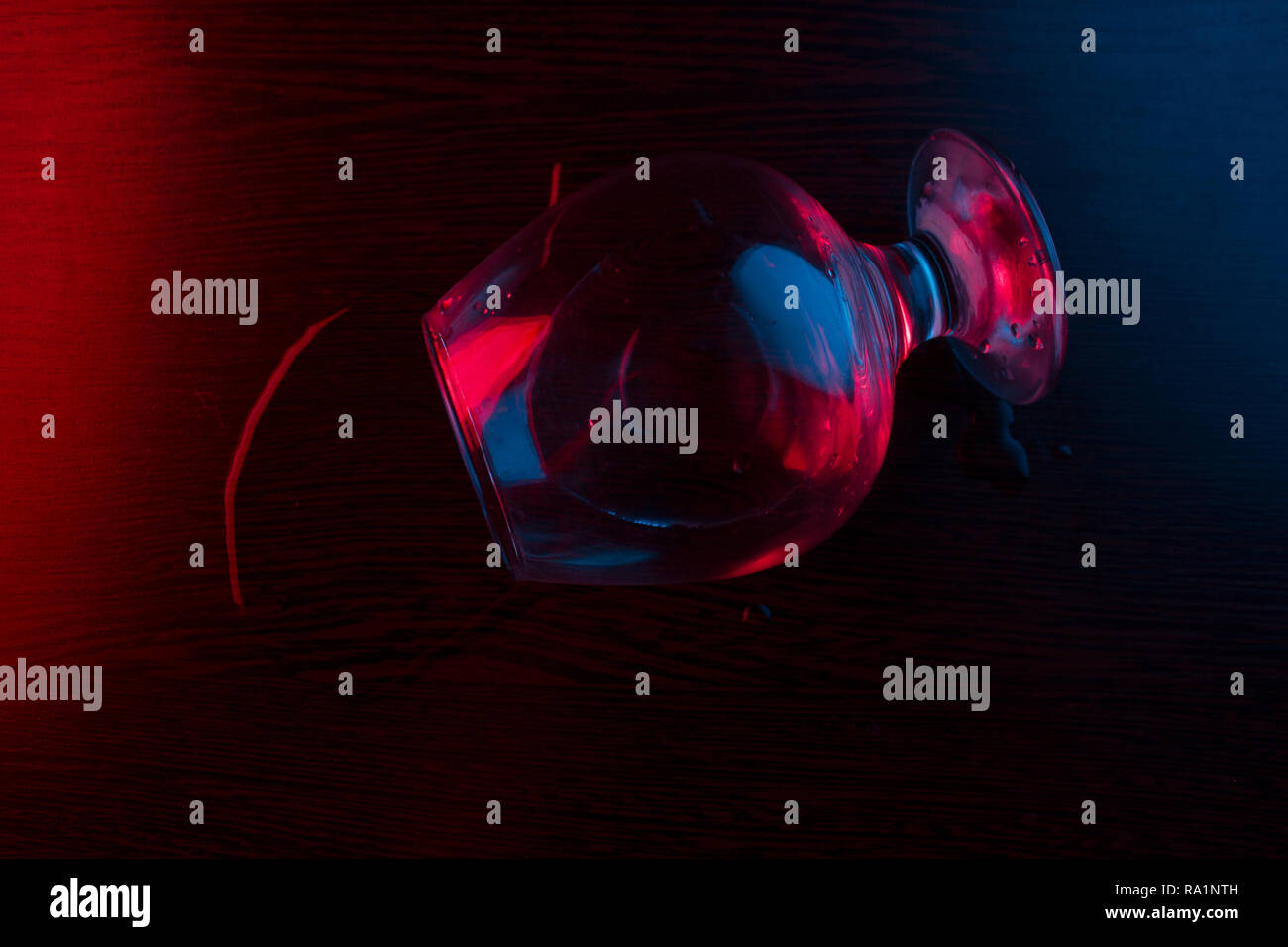 alcohol split from glass. on dark background Stock Photo - Alamy