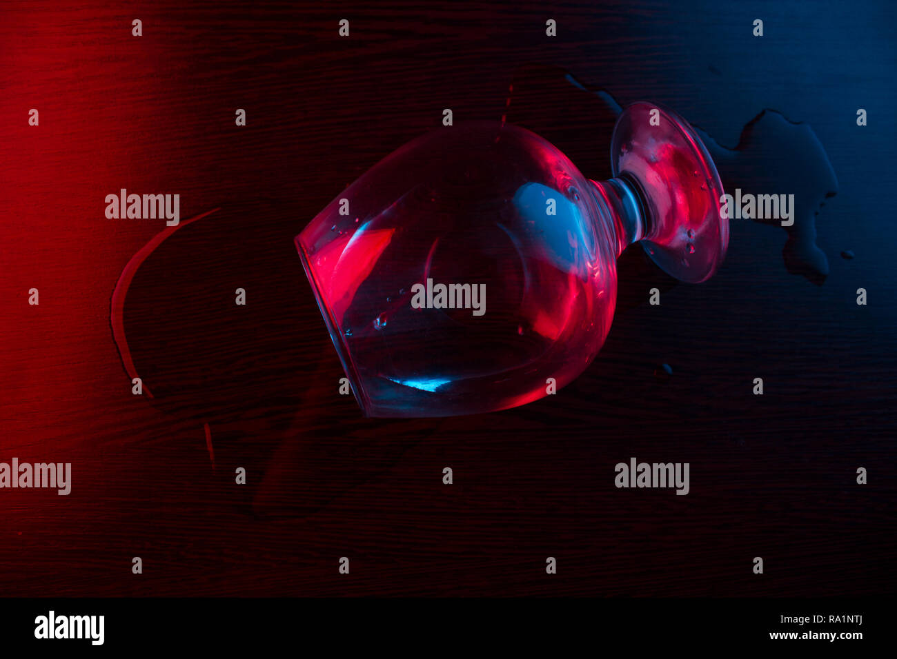 alcohol split from glass. on dark background Stock Photo - Alamy