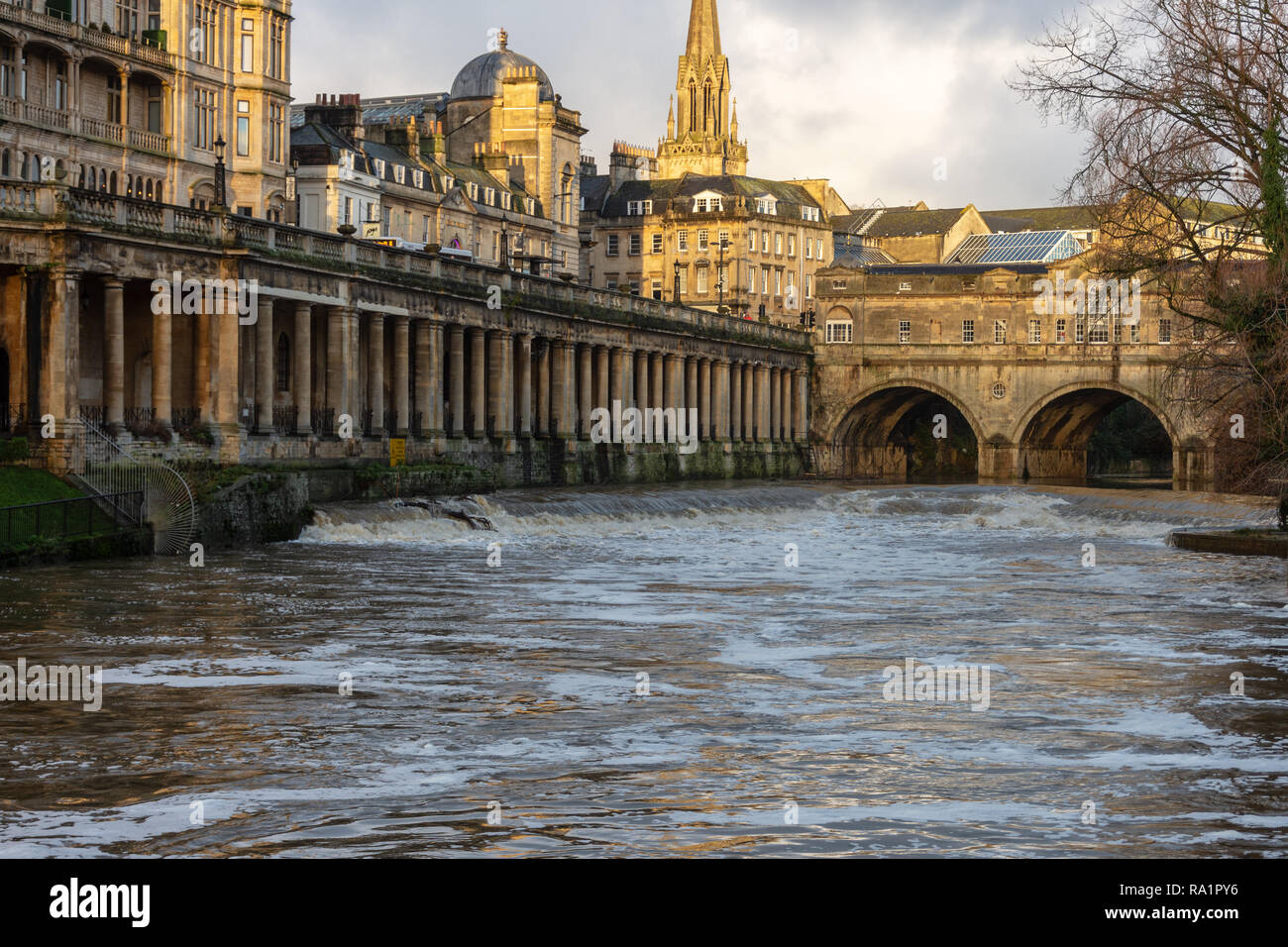 Winter mornings view across the River Avon in flood encompassing ...