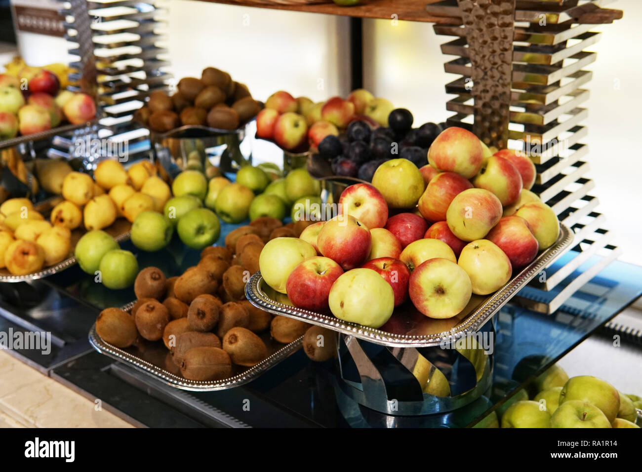 plates with fresh fruit in the kitchen citrus apples healthy food Stock ...