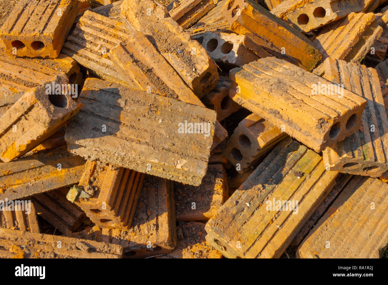 Pile of old red bricks in construction area Stock Photo - Alamy