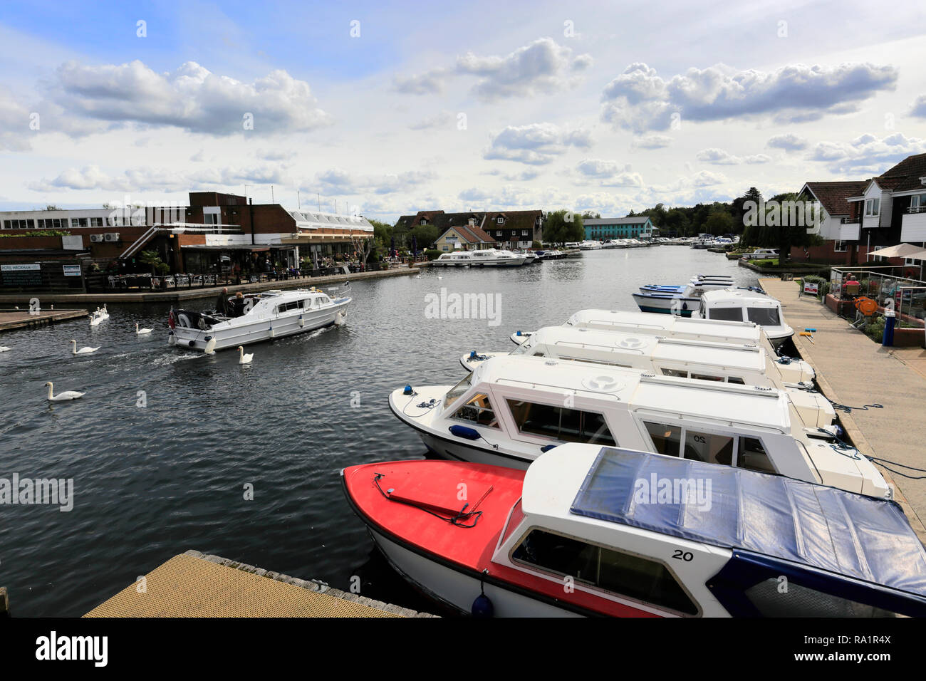 Pleasure boats on the River Bure at Wroxham town in the Norfolk Broads ...