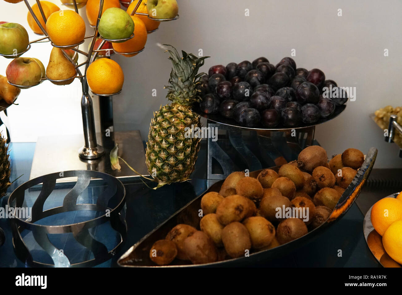 plates with fresh fruit in the kitchen citrus apples healthy food Stock ...