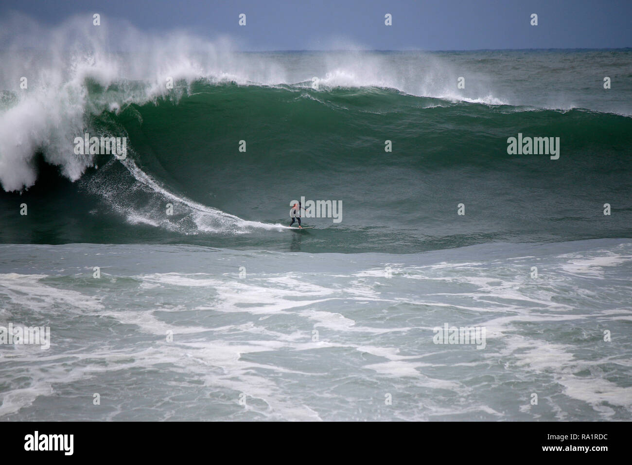 Big wave surfer hi-res stock photography and images - Alamy