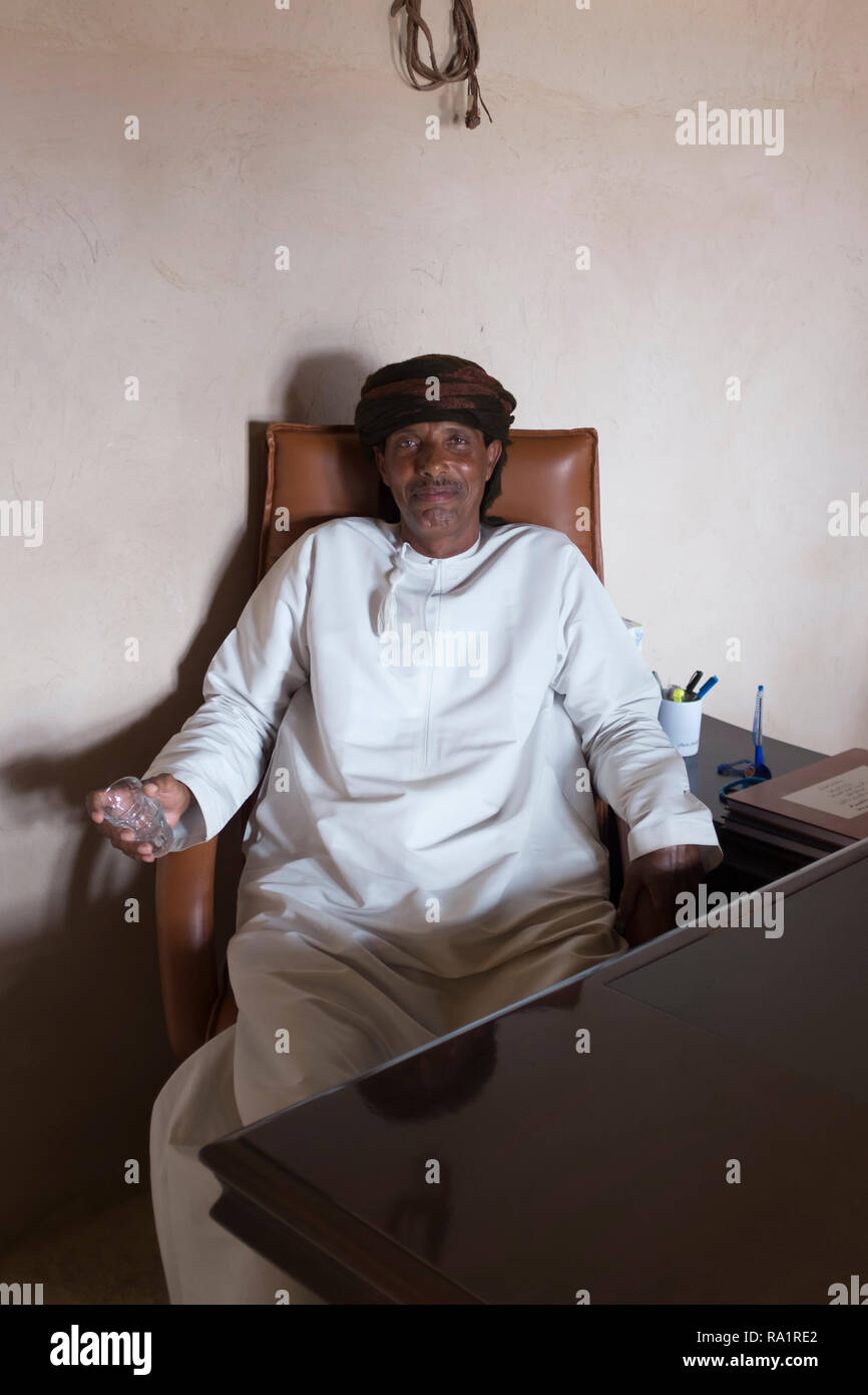 Tour guide Mussallem wearing traditional Omani dress of a white ...