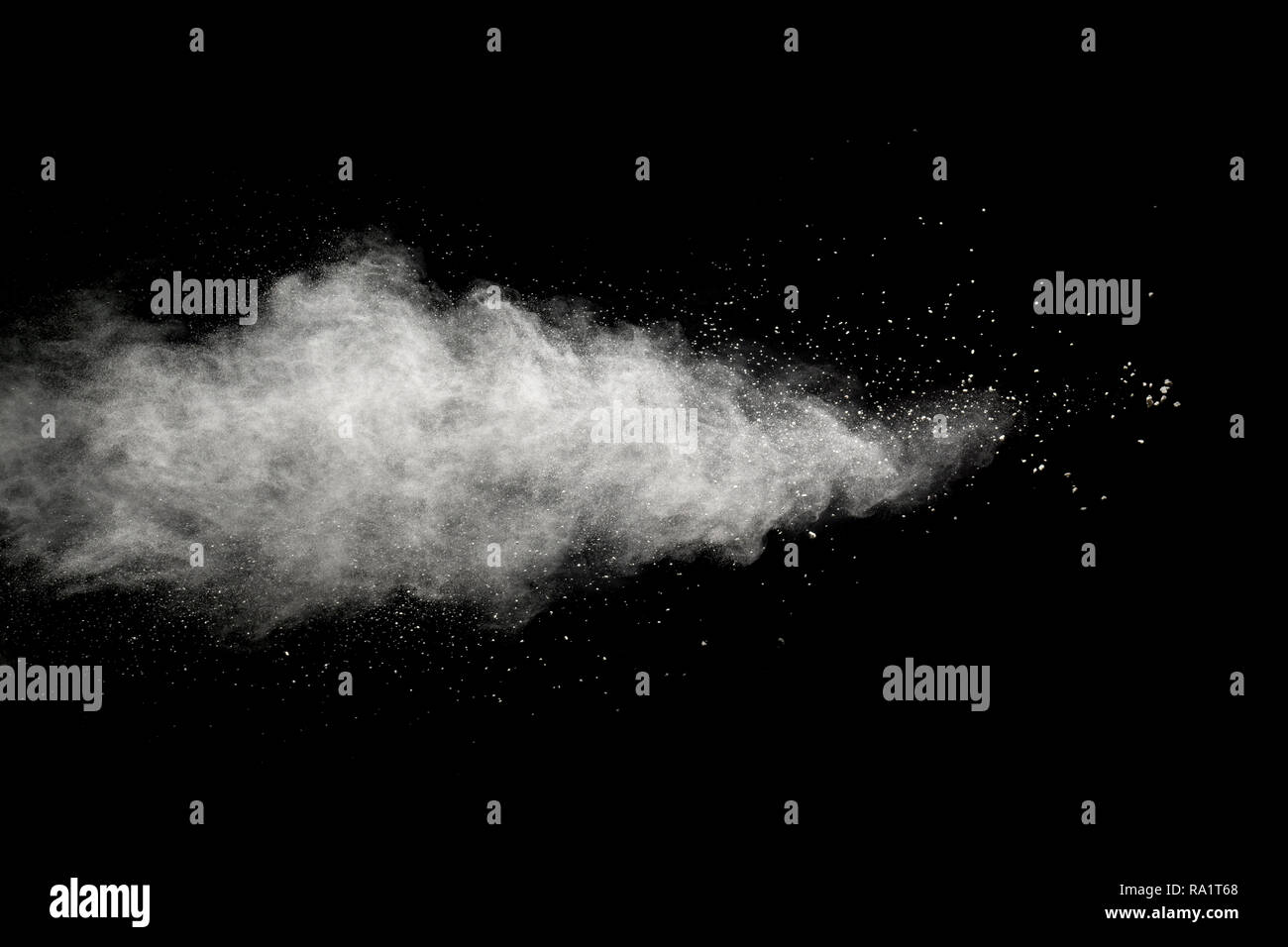 Launched white powder splash on black background Stock Photo - Alamy