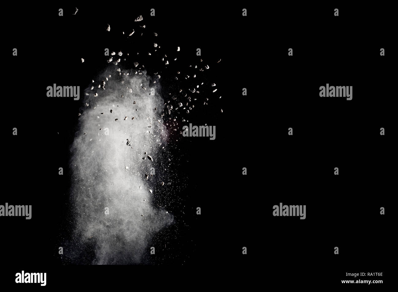 Launched white powder white small stones splash on black background ...