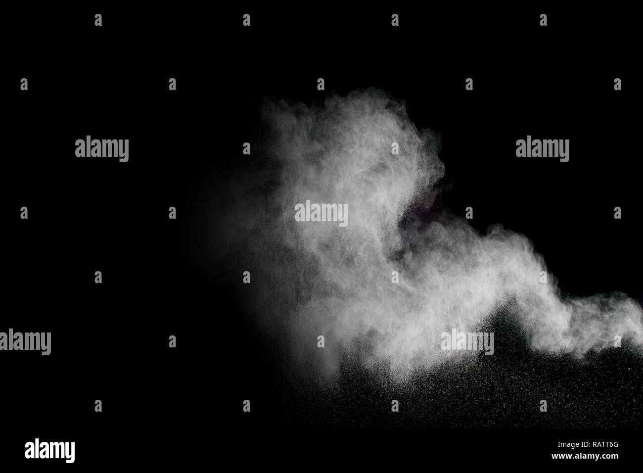 Launched white powder splash on black background Stock Photo - Alamy
