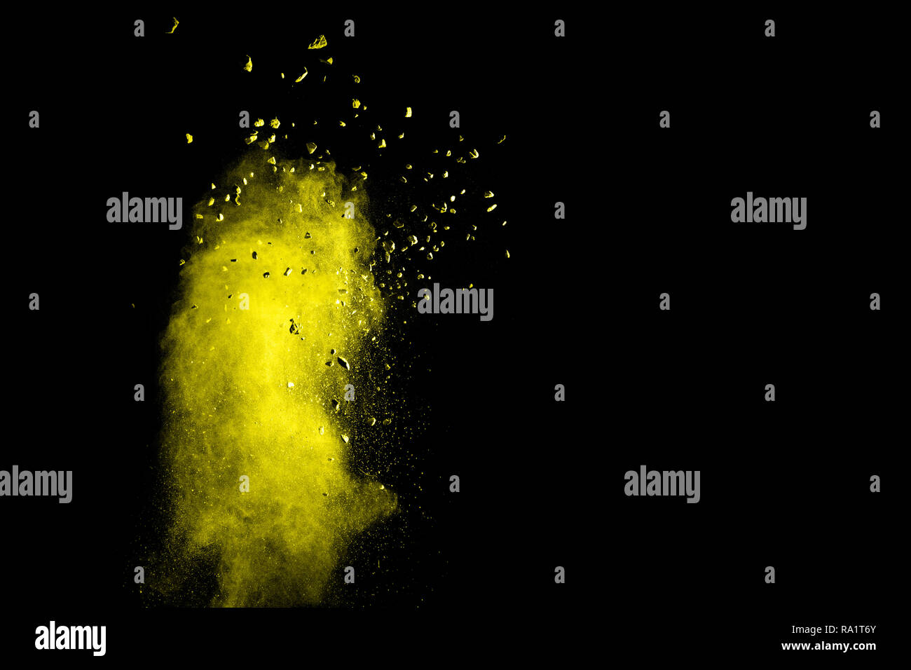 abstract yellow dust explosion on black background. abstract yellow ...