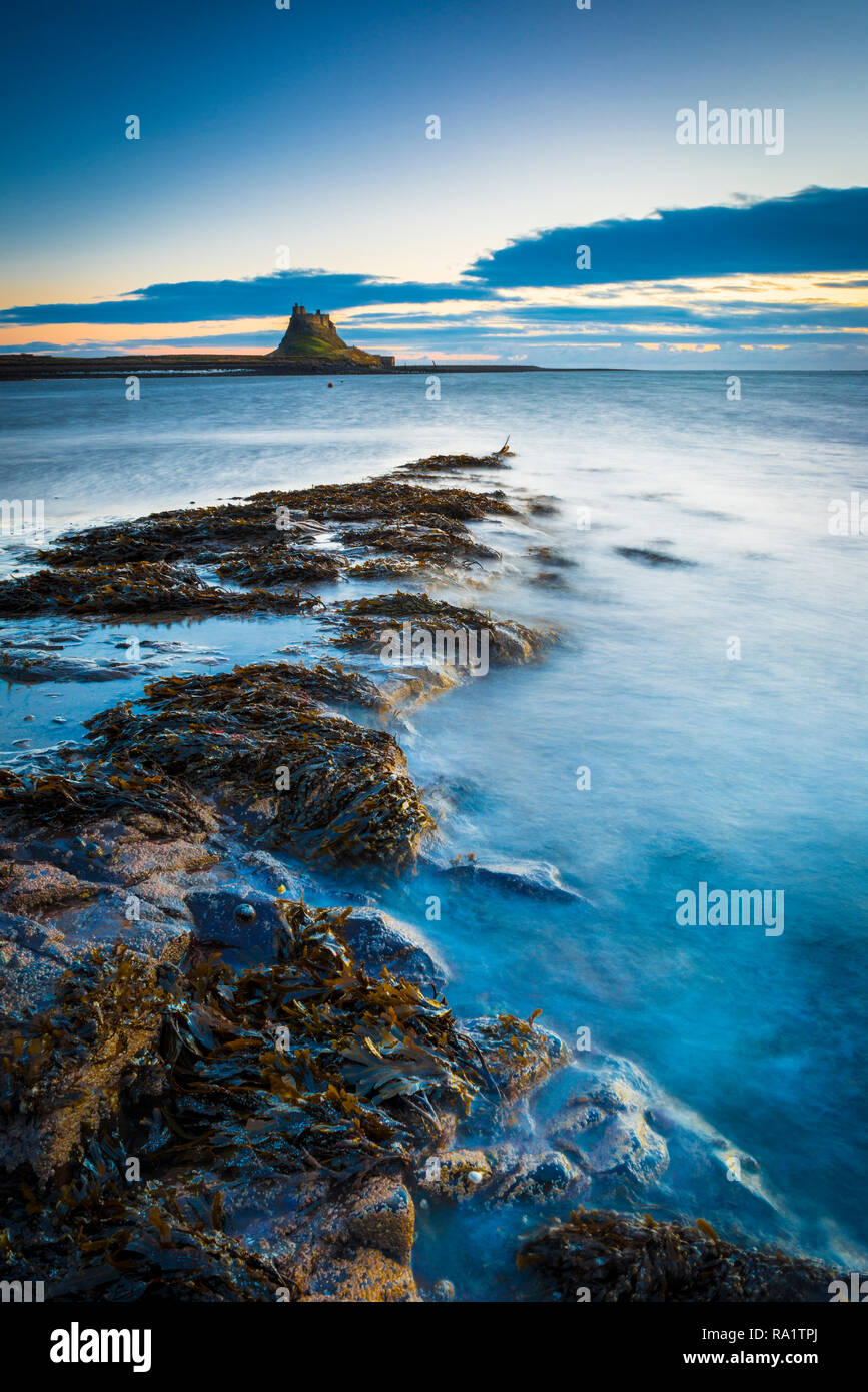 A cold & windy winters sunrise on Holy Island down by the jetty in the ...