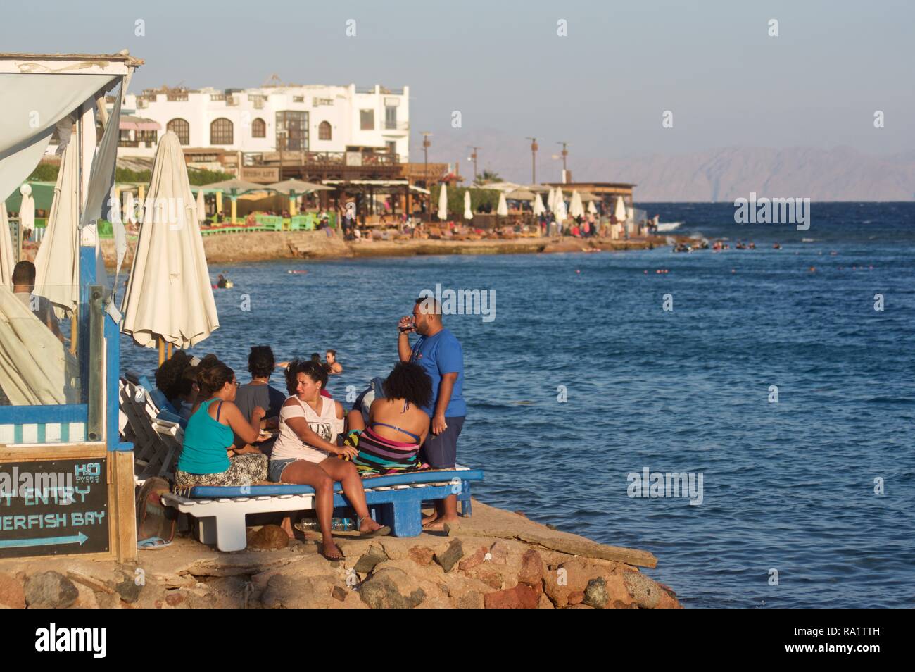 People enjoying drinks by the water, Dahab, Egypt Stock Photo - Alamy