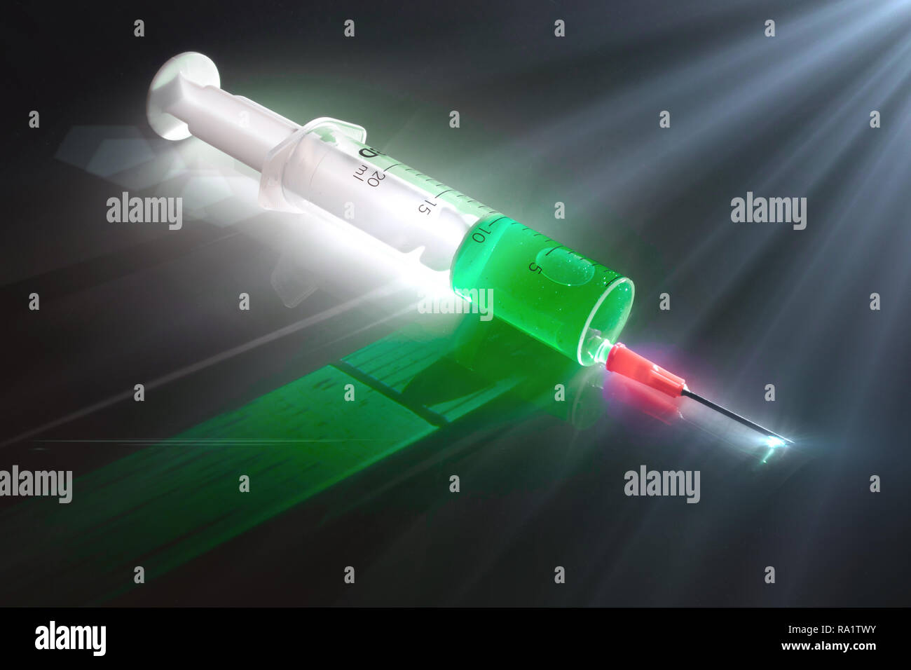 Syringe with medication illuminated laterally, conceptual image Stock ...