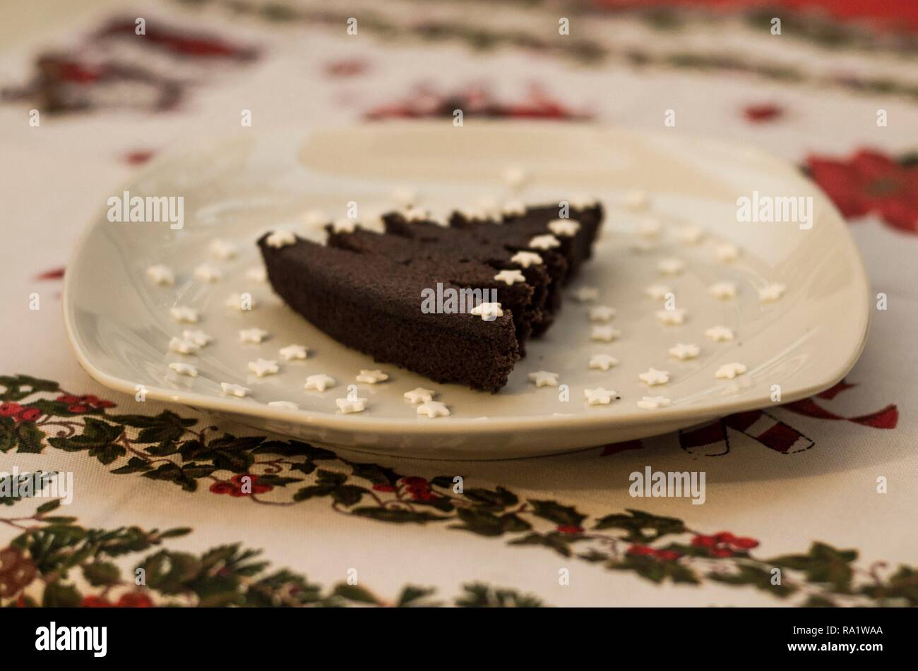 Christmas tree shaped chocolate cake with sugar stars Stock Photo - Alamy