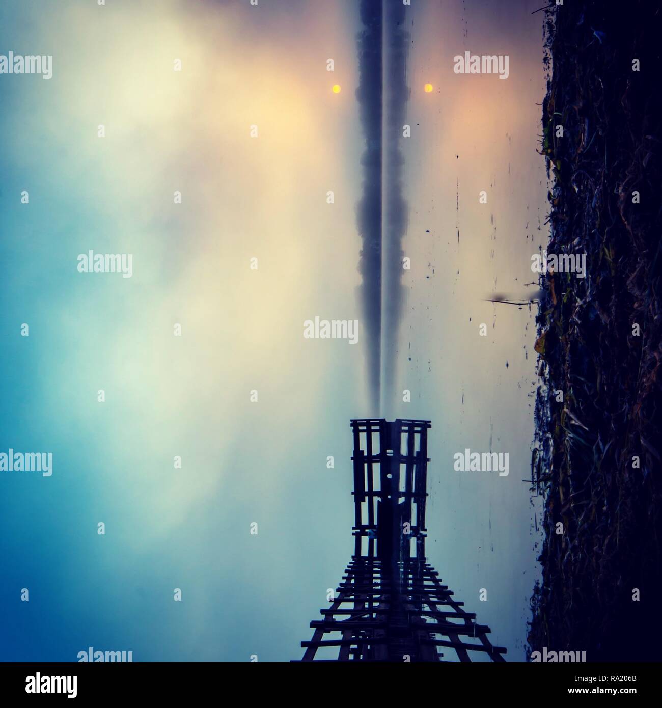 The sun rises behind the fog over this mysterious lake Stock Photo - Alamy