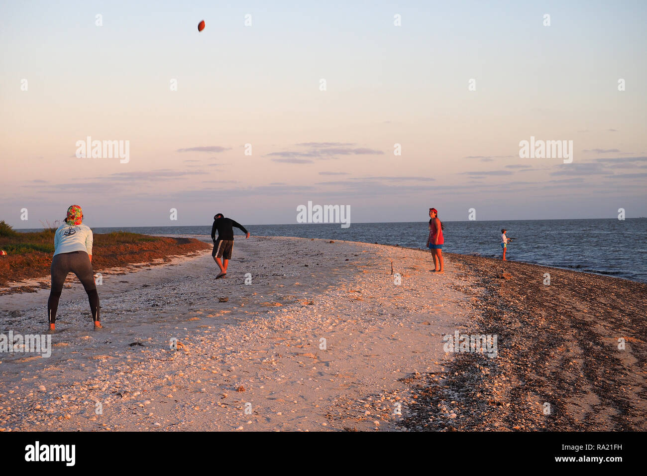 Everglades National Park, Florida 02-12-2017 Friends play football on ...