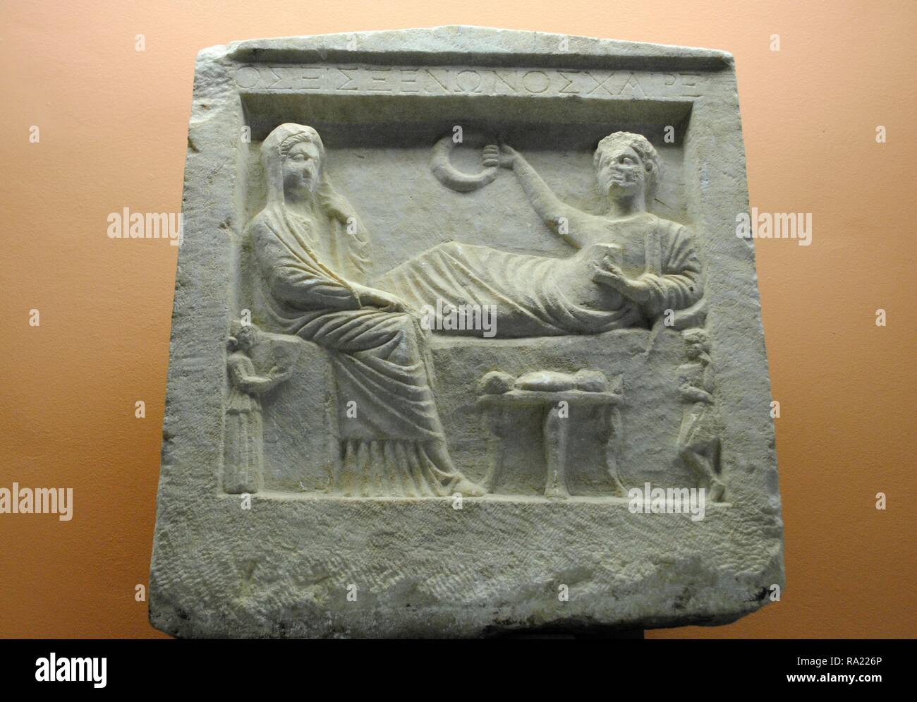 Tombstone. "Parting scene" in relief. Deceased stretched in a ...