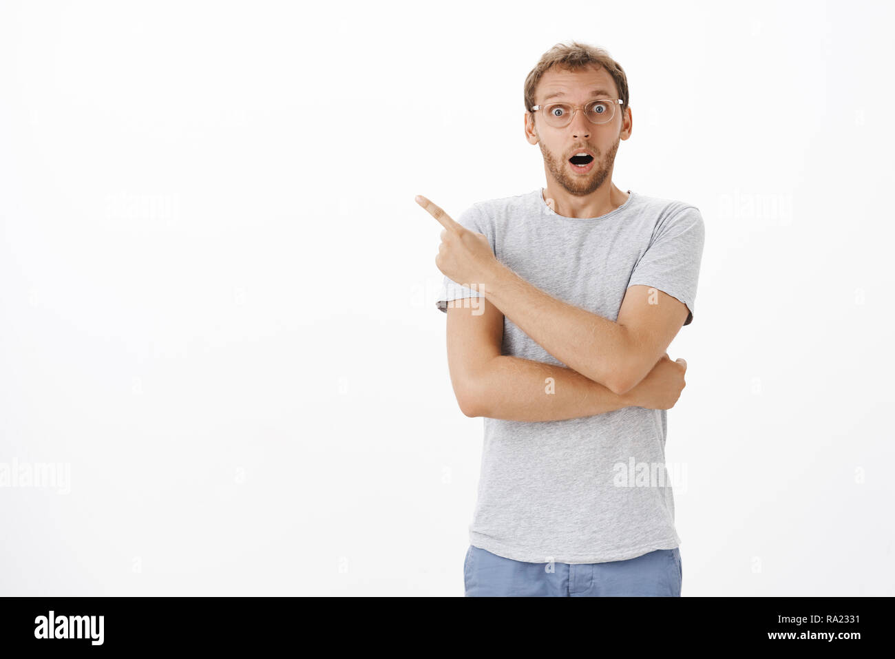 Astonished guy showing surprise hi-res stock photography and images - Alamy