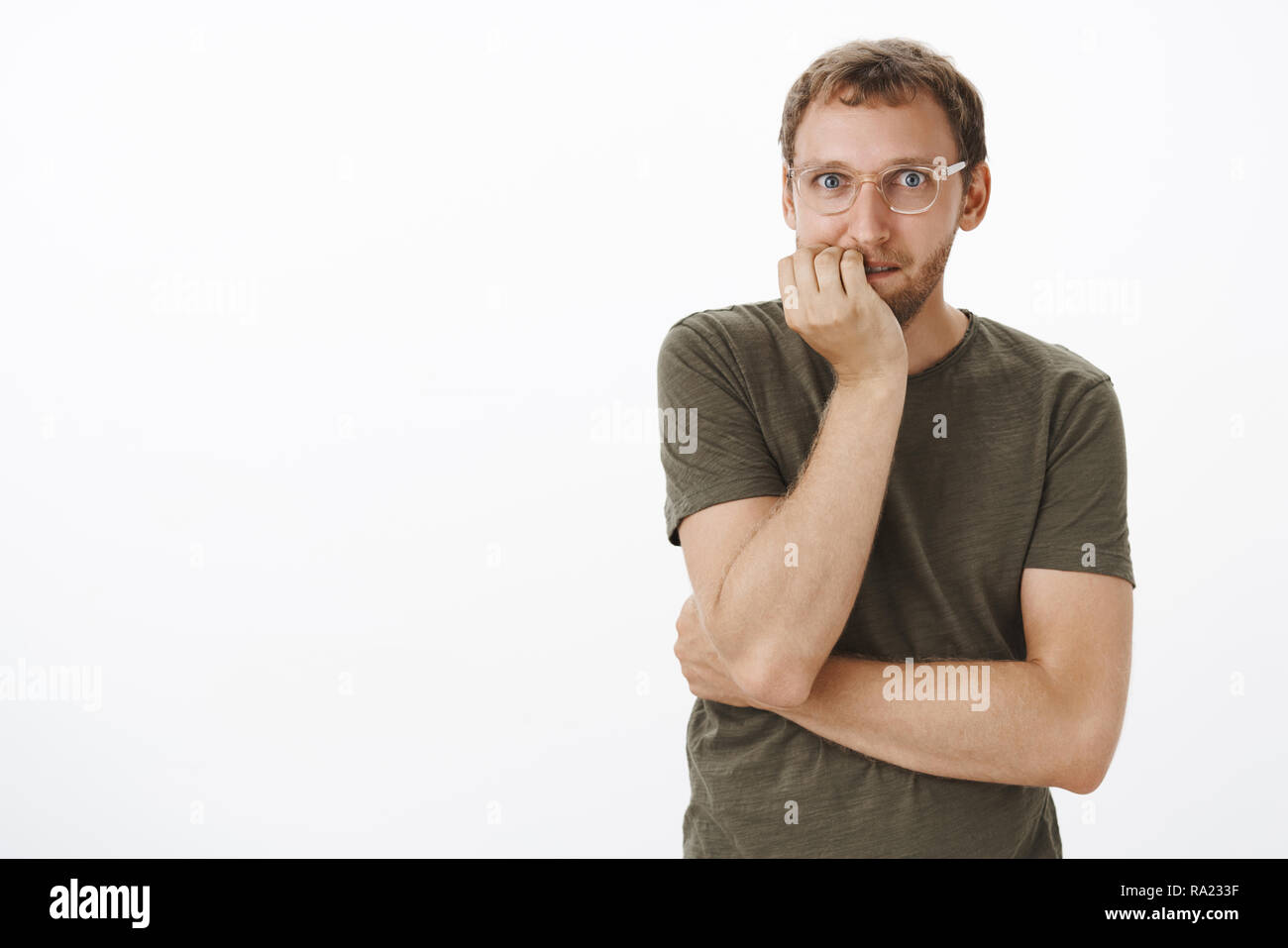 Man listening exciting and intriguing rumor biting fingernails from ...