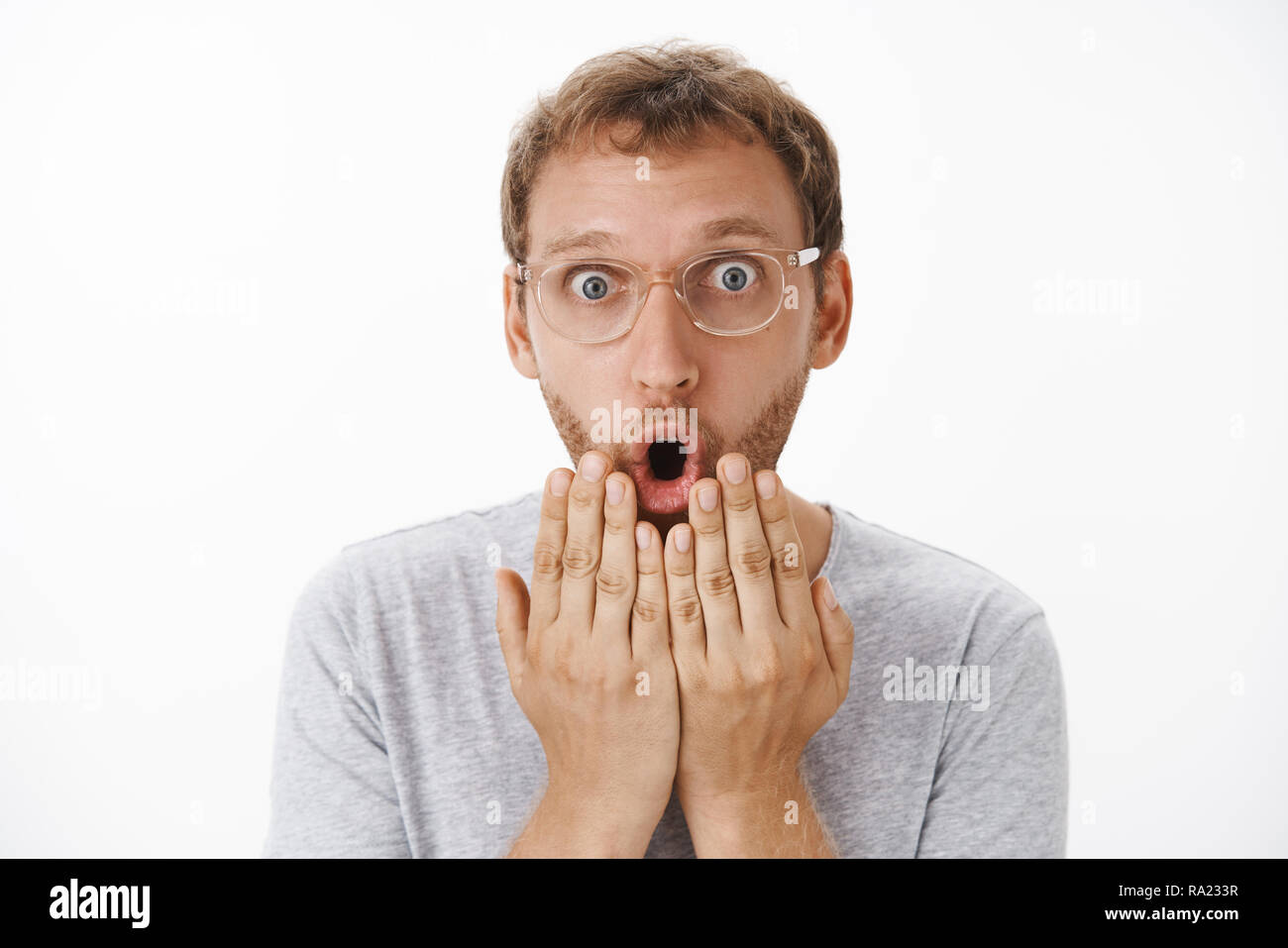 Close-up shot of impressed shocked and fascinated charming caucasian ...