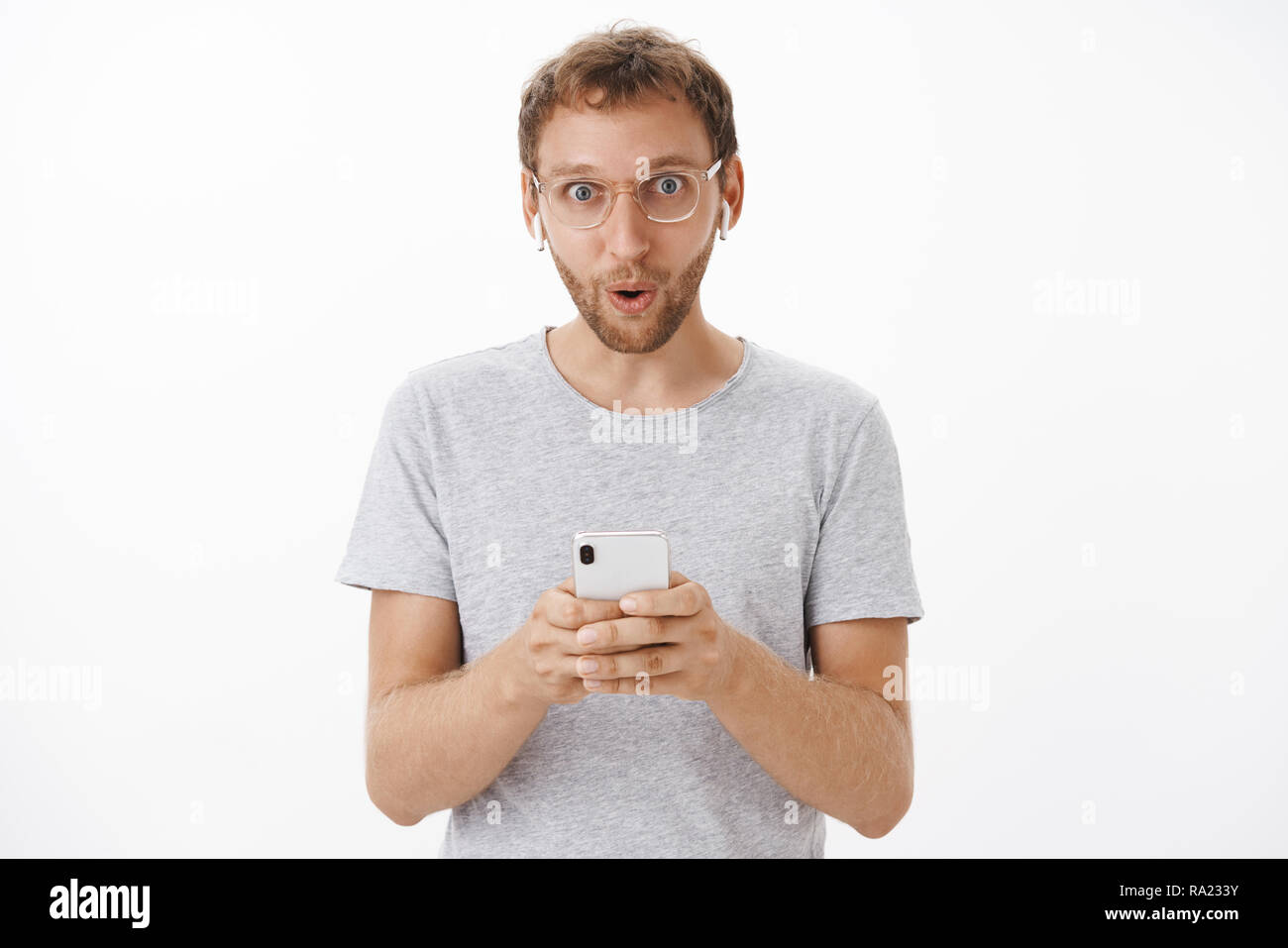 Man getting fascinated with awesome sound of new wireless earphones ...