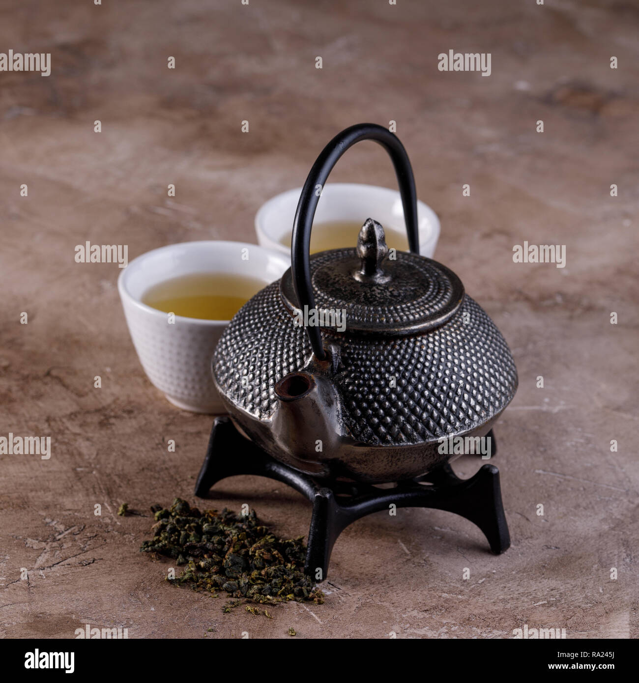 Traditional Asian herbal tea, cooked in a cast-iron kettle with dry ...