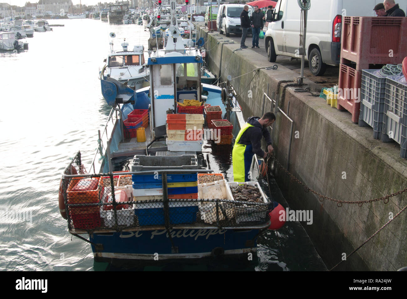 Unloading fish boxes from fishing hi-res stock photography and images ...