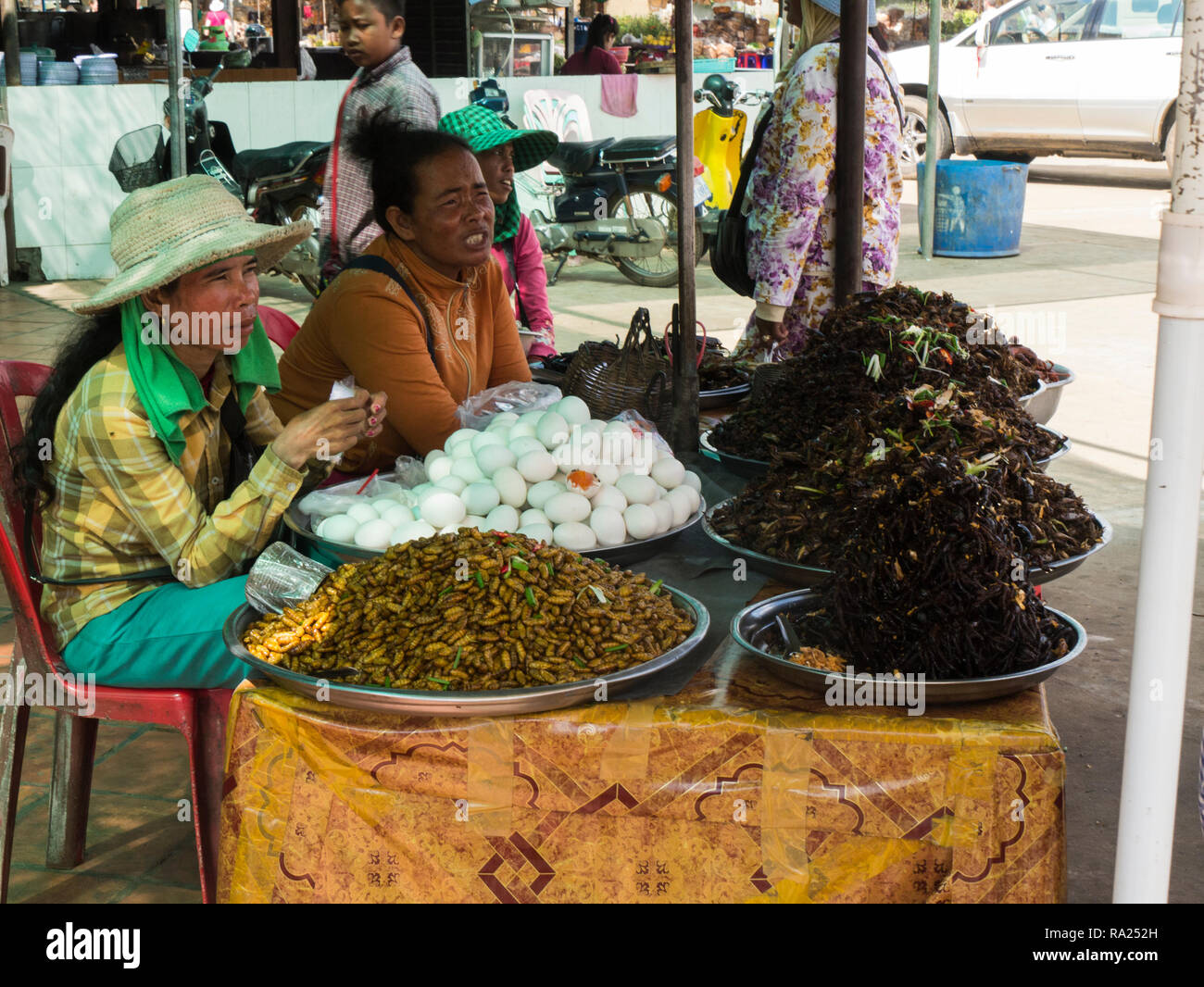 Female stallholders at Skuon Town Spider market selling eggs and deep ...