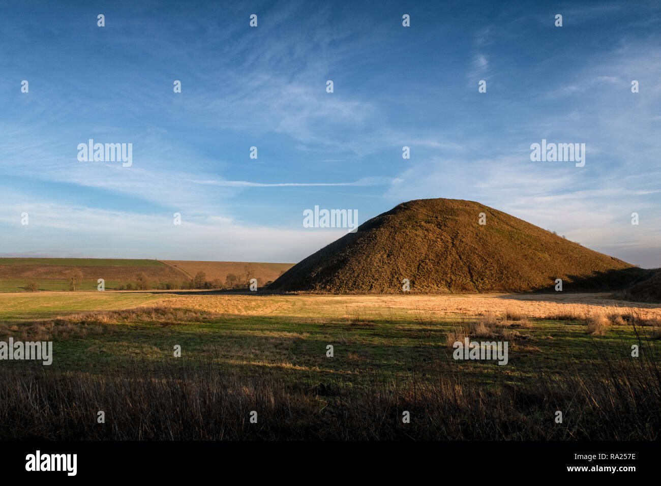 Silbury Hill is a prehistoric artificial chalk mound near Avebury in ...