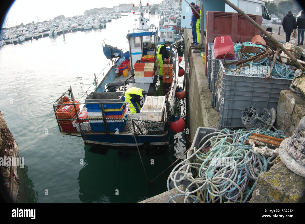 Unloading fish boxes from fishing hi-res stock photography and images ...
