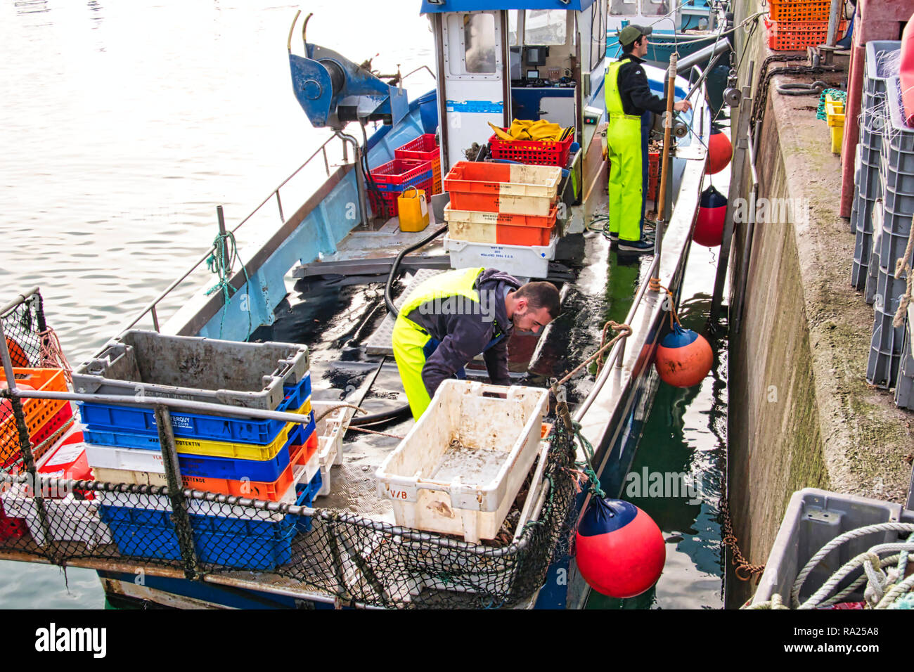 Unloading fish boxes from fishing hi-res stock photography and images ...