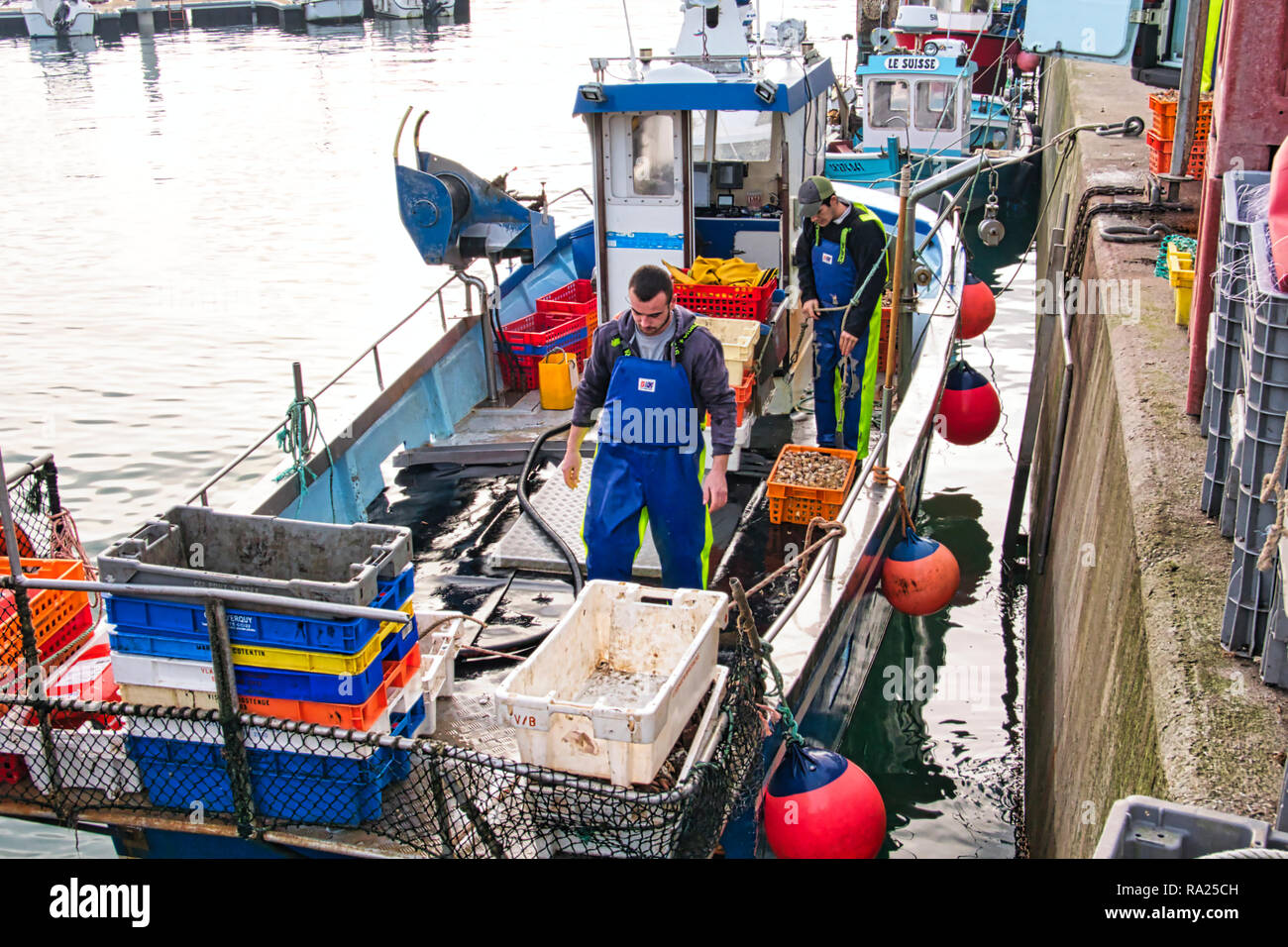 Unloading fish boxes from fishing hi-res stock photography and images ...