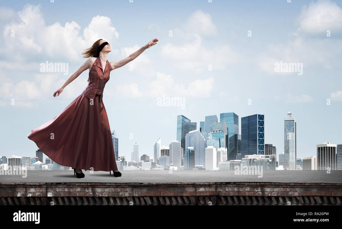 Blind woman in long red dress at top of building. Mixed media Stock ...