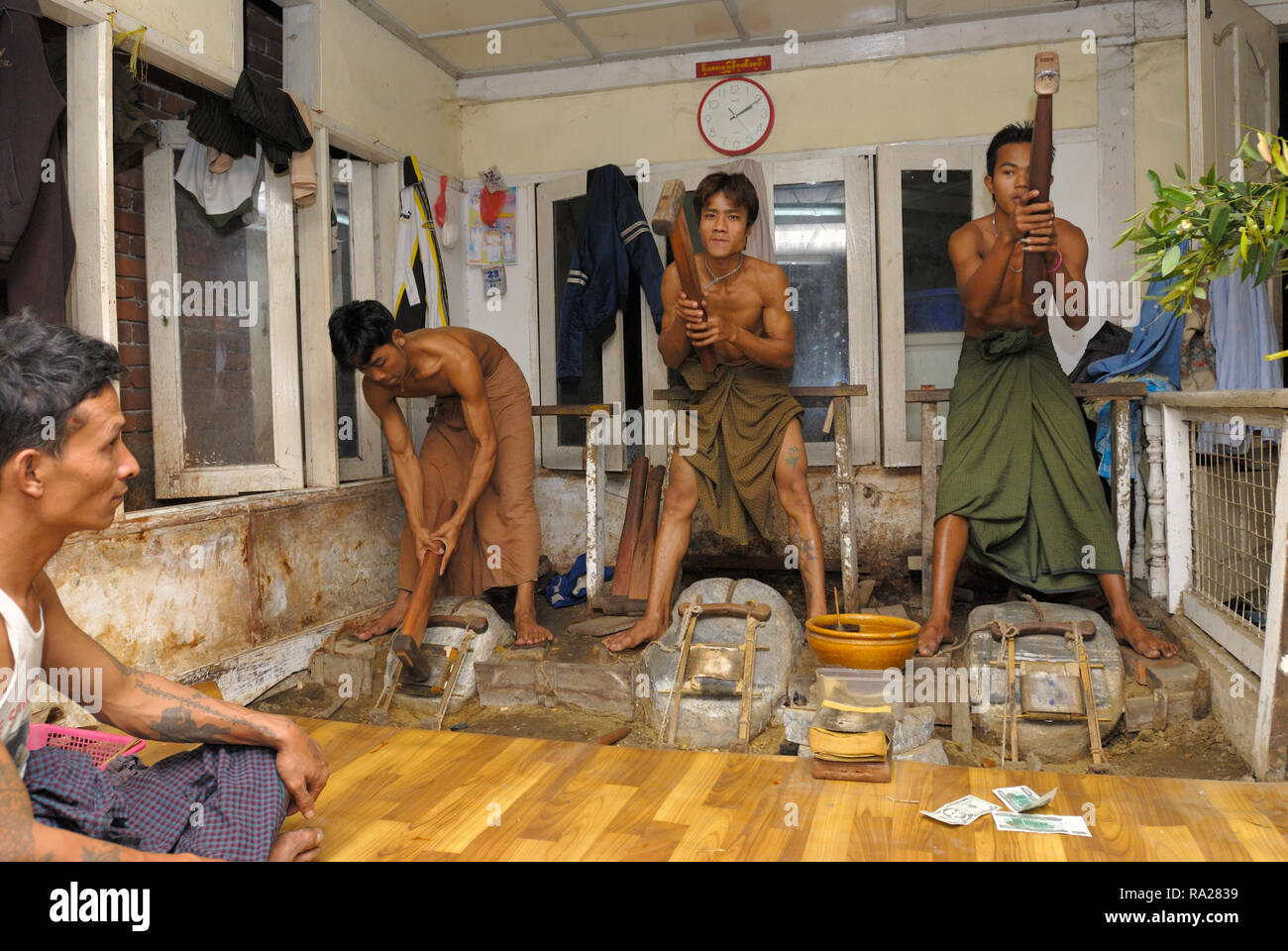 gold beating, young men beating with 3 kg beater beating hours on ...