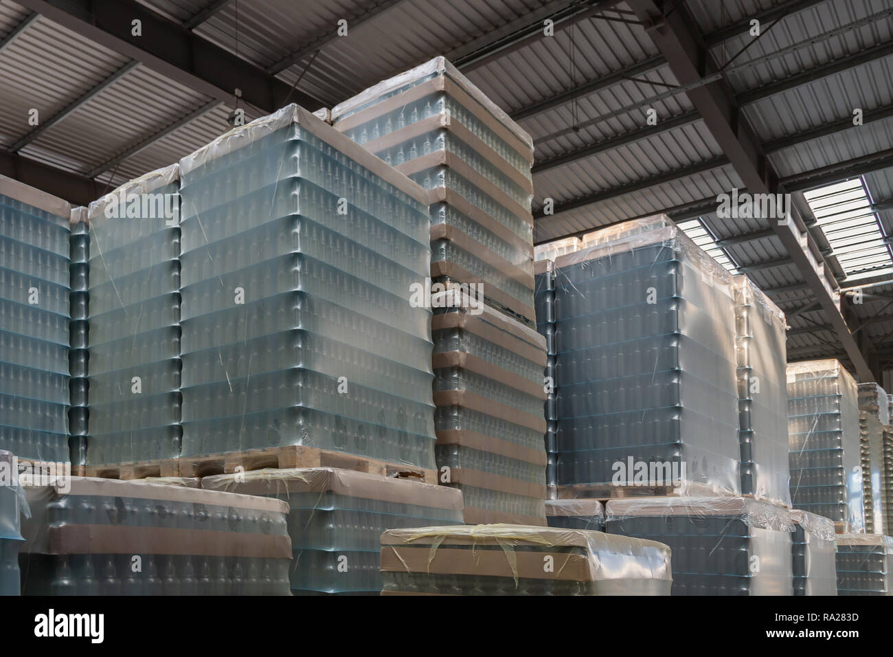 Warehouse interior. Warehouse with packed glass bottles. Spacious ...