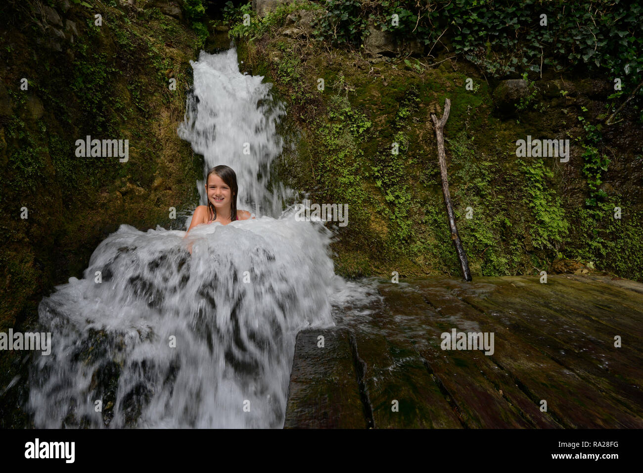 Taking bath under waterfall hi-res stock photography and images - Alamy