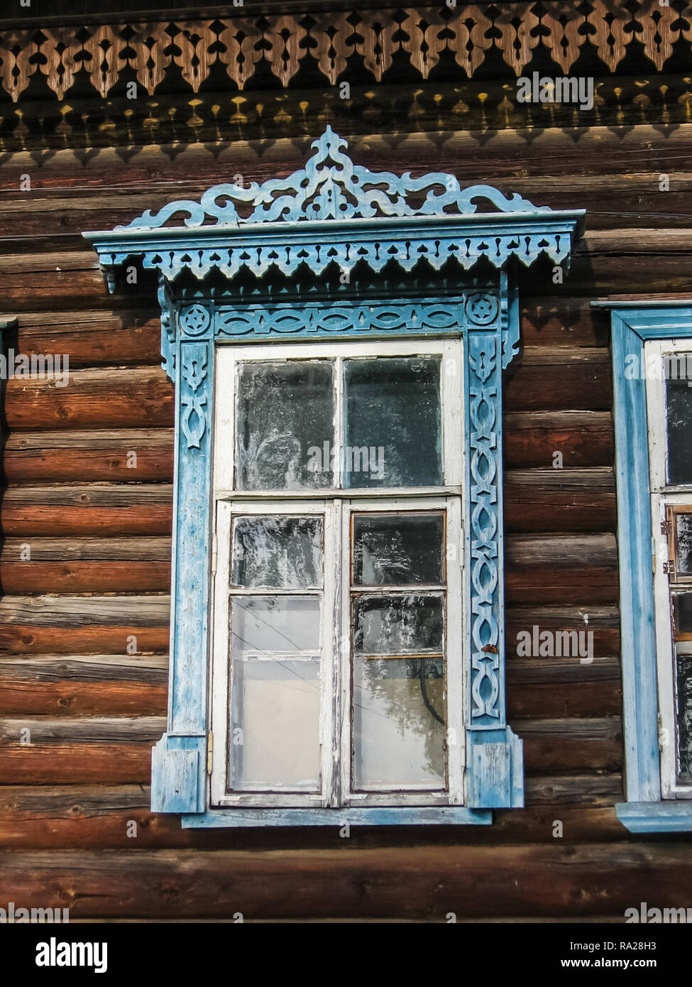 Plinths of windows of wooden houses. Ancient style of decoration of ...