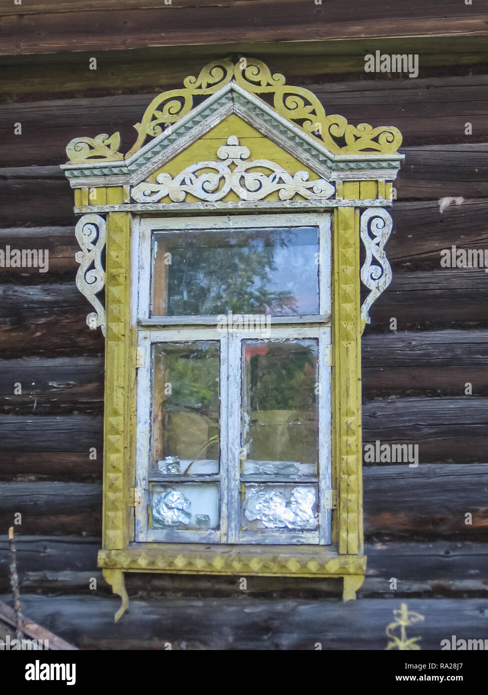 Plinths of windows of wooden houses. Ancient style of decoration of ...