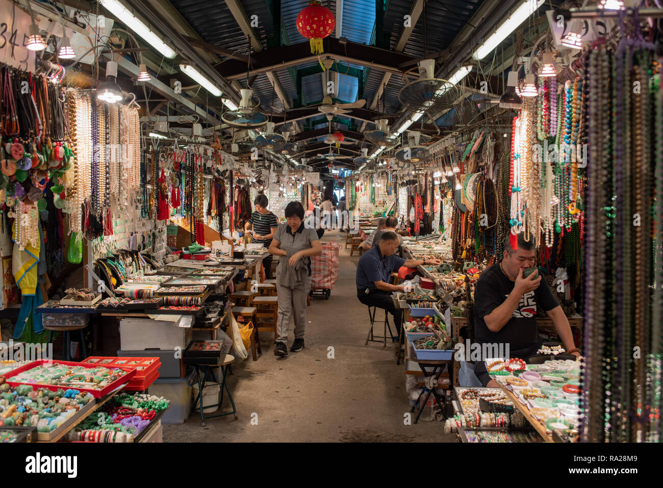 Stall holders at Hong Kong's famous Jade Market with their colourful ...
