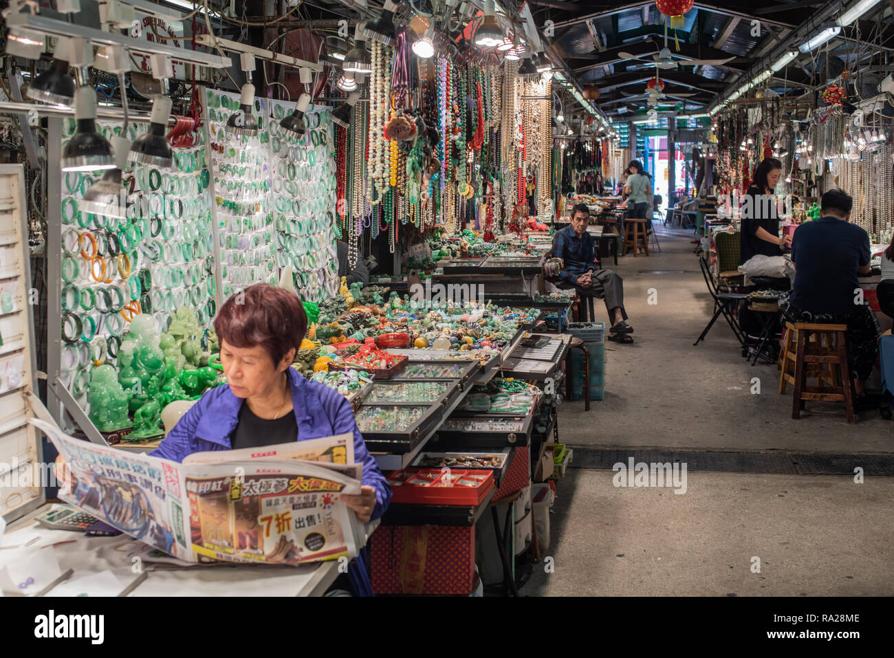 Stall holders at Hong Kong's famous Jade Market with their colourful ...