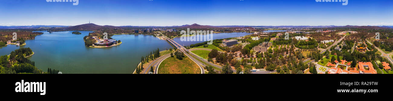 Ultra wide aerial panorama over Canberra capital city of Australia from parliament house on the ...