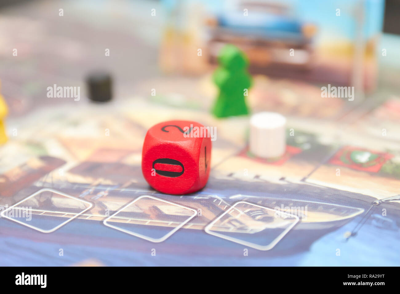 Cubes with the game monopoly on the table Stock Photo - Alamy