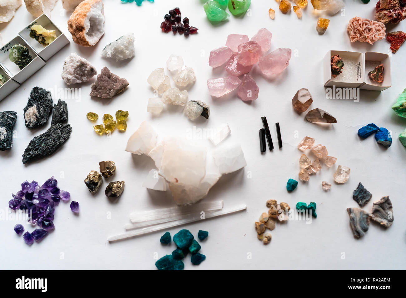 Collection of beautiful precious stones on white table Stock Photo - Alamy