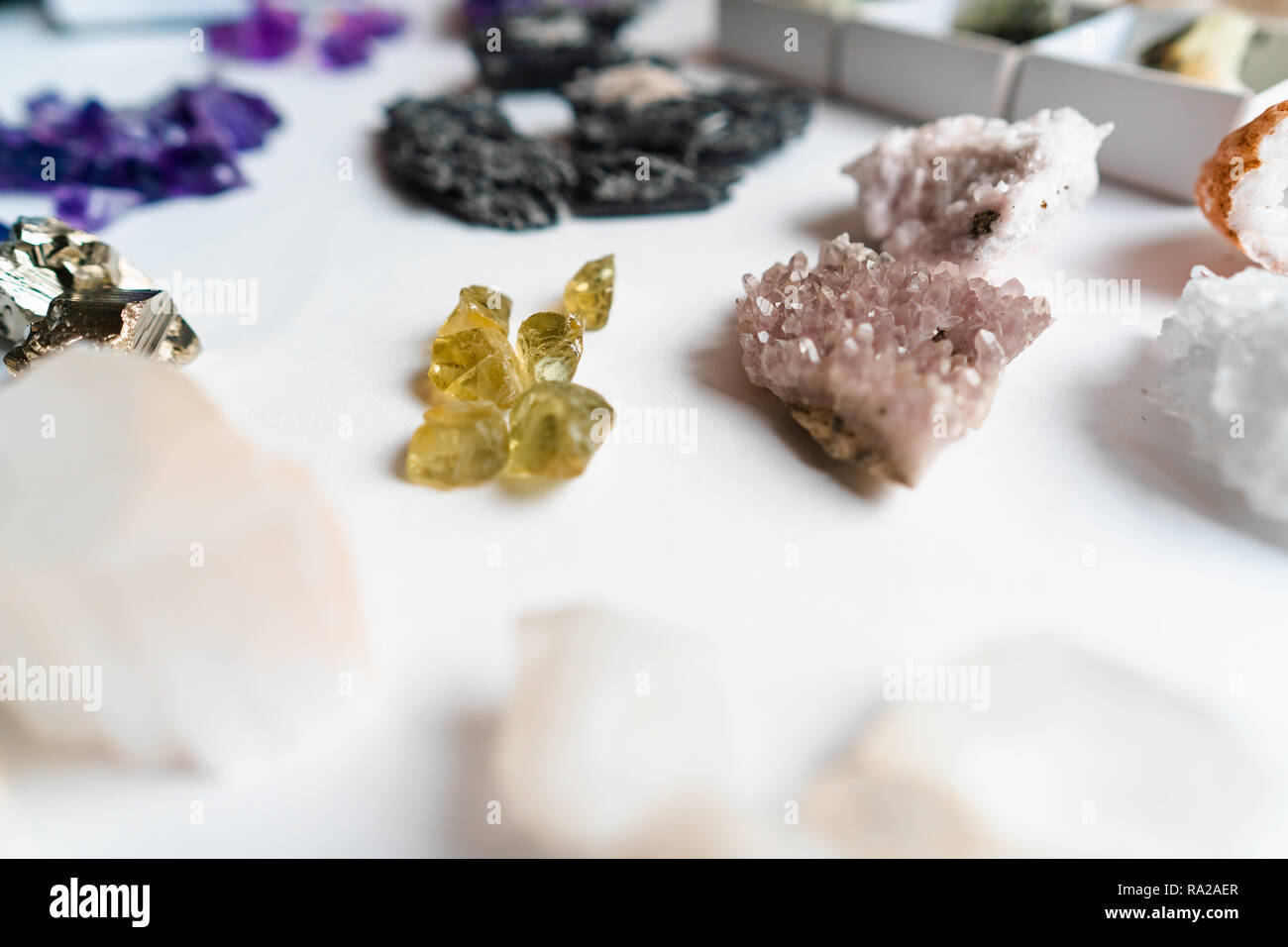 Collection of beautiful precious stones on white table Stock Photo - Alamy
